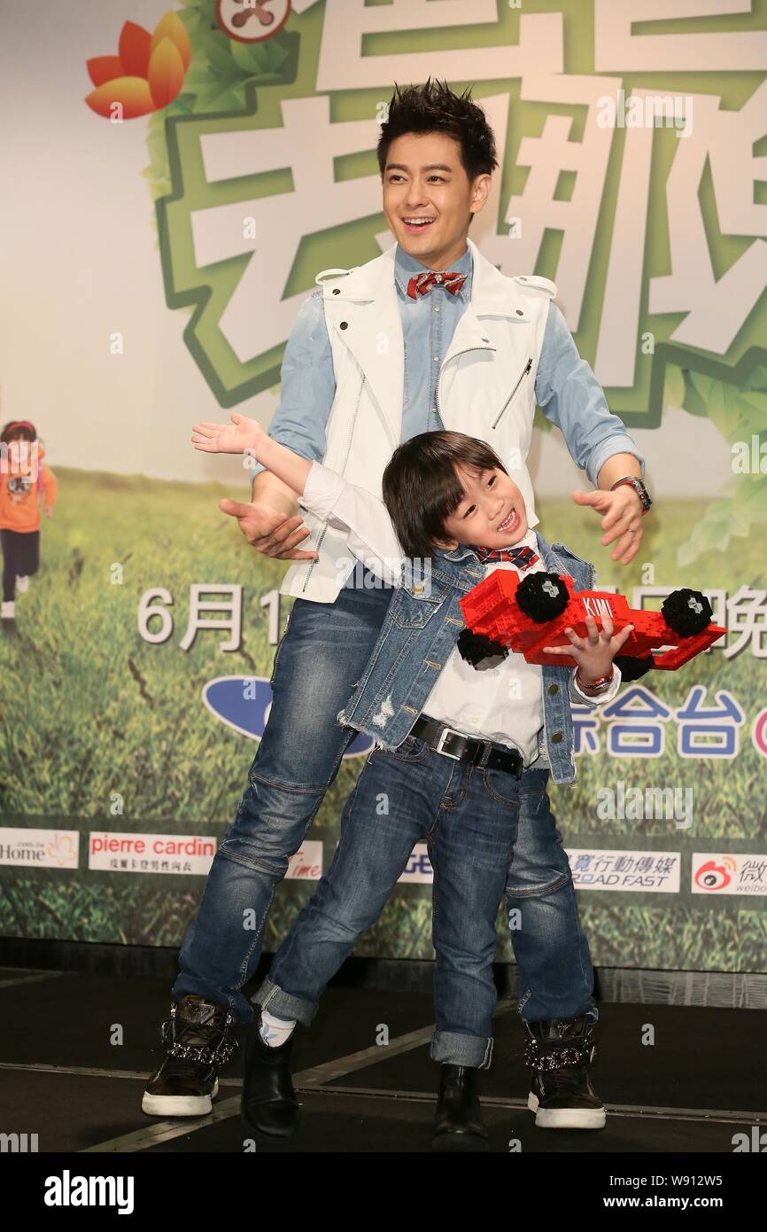 Taiwanese singer and actor Jimmy Lin, back, and his son Kimi pose ...