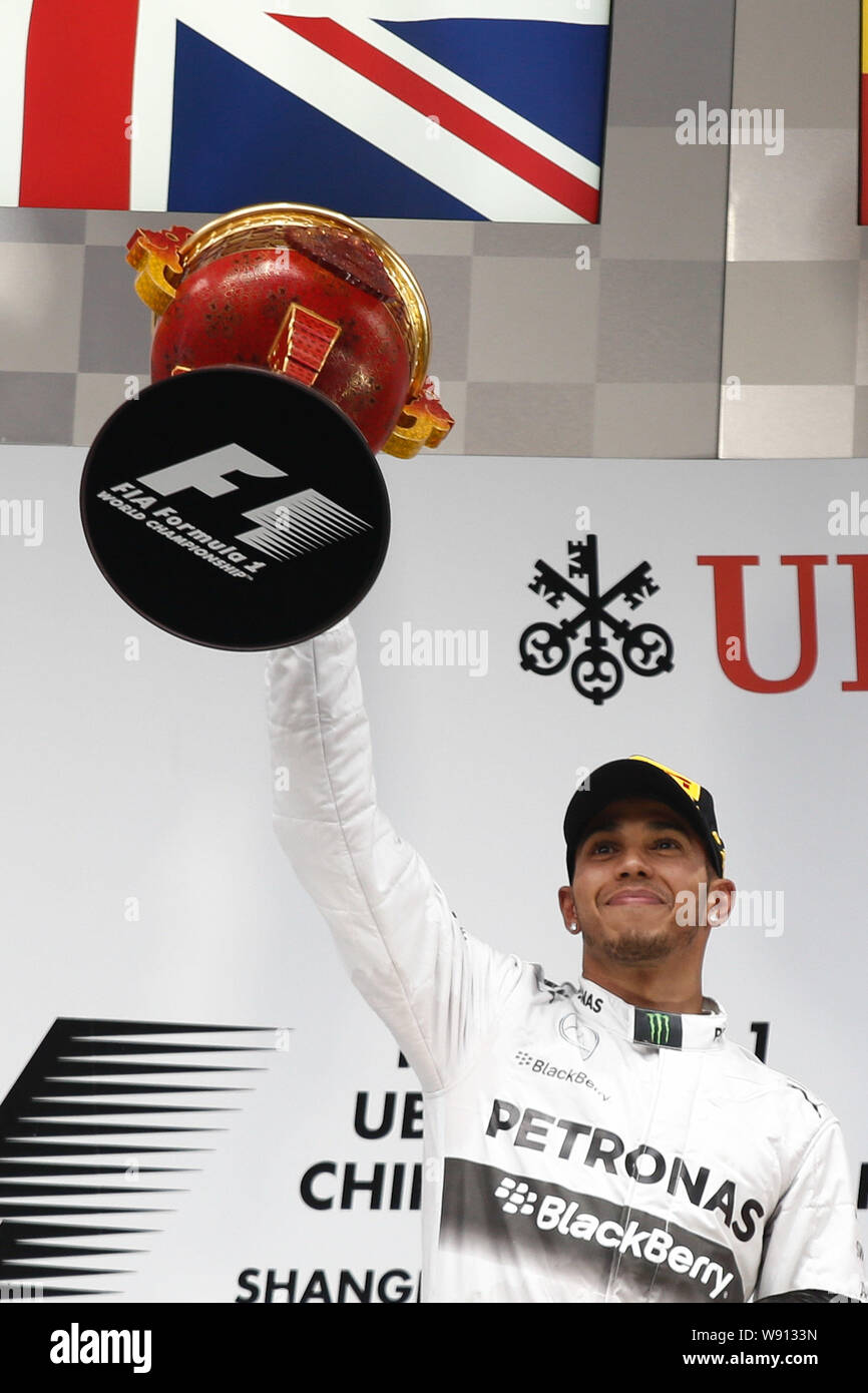 British F1 driver Lewis Hamilton of Mercedes AMG Petronas F1 Team holds ...