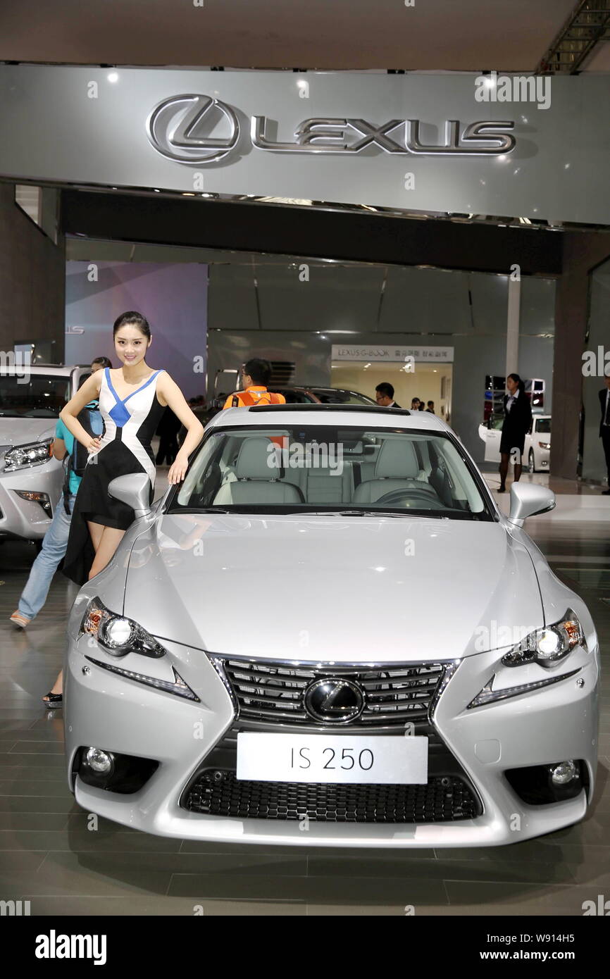 --FILE--A model poses with a Lexus IS 250 during the 11th China ...