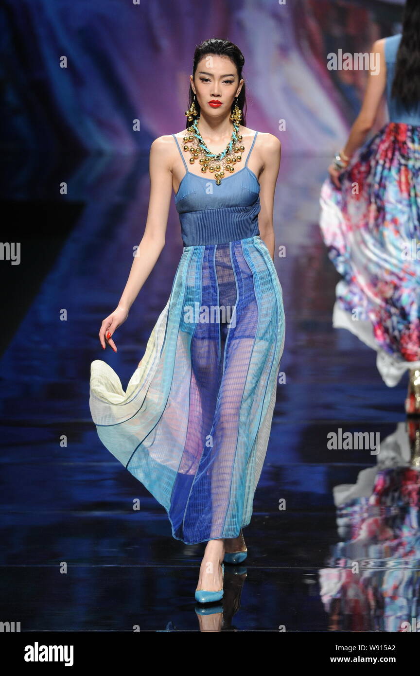 A model displays a new creation by designer Chen Wen at the d¯nim Chen ...