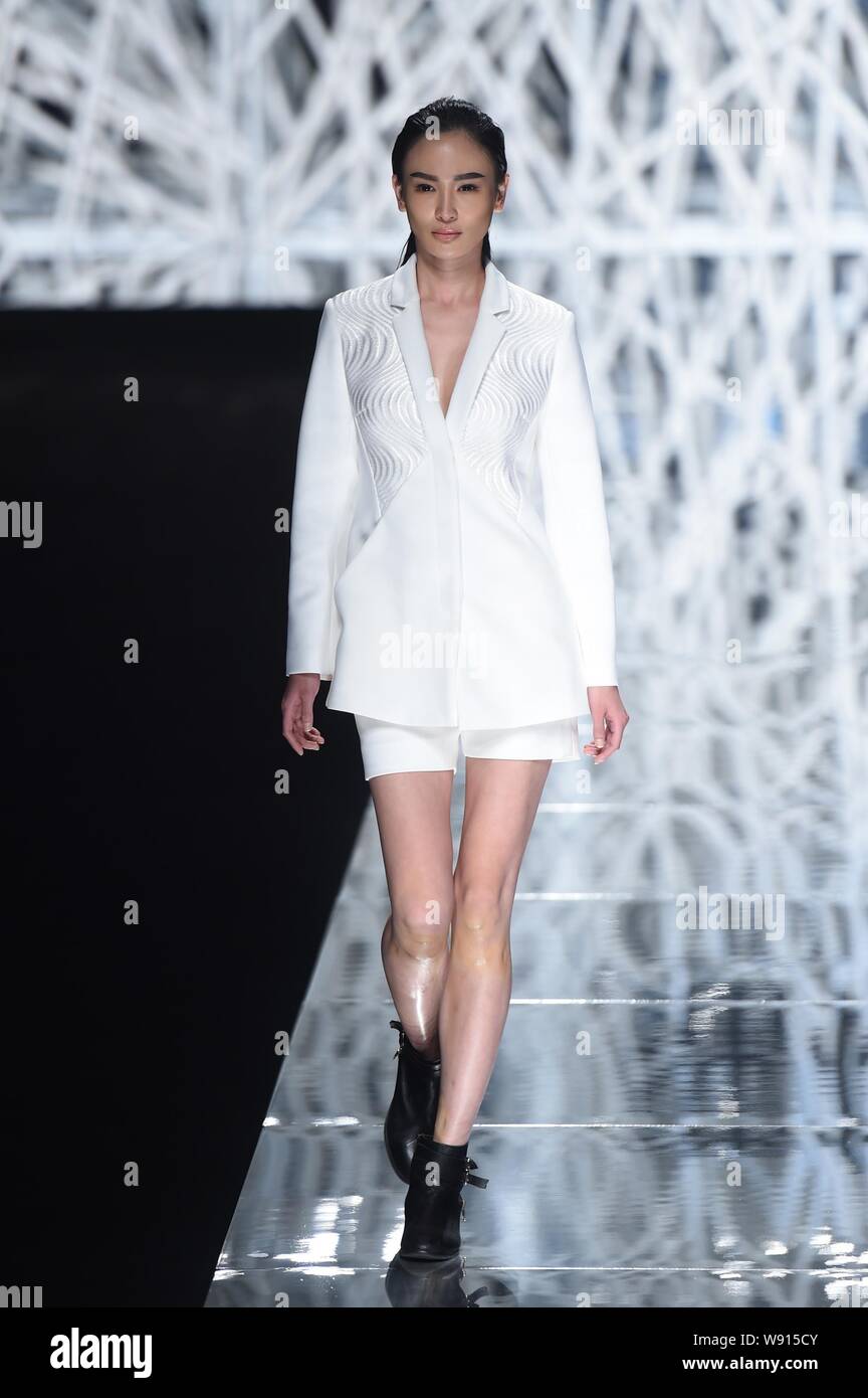 A model displays a new creation by designer Pan Yiliang at the Gioia ...