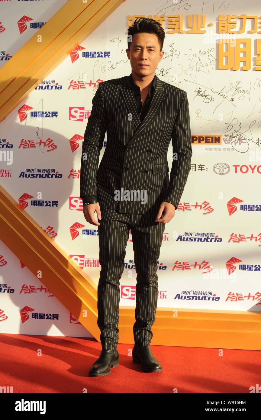 Chinese actor Du Chun poses on the red carpet for the fifth anniversary ...