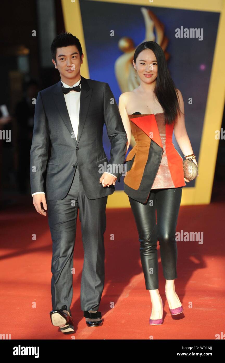 Chinese actress Huo Siyan, right, and her actor husband Du Jiang arrive ...