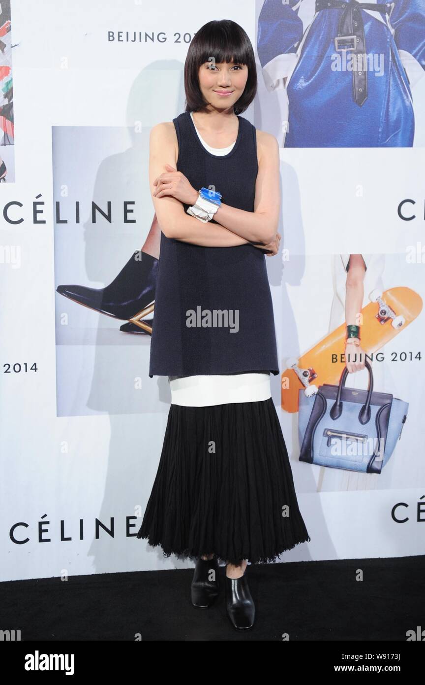 Chinese actress Yuan Quan poses as she arrives at the Celine 2014 Fall ...