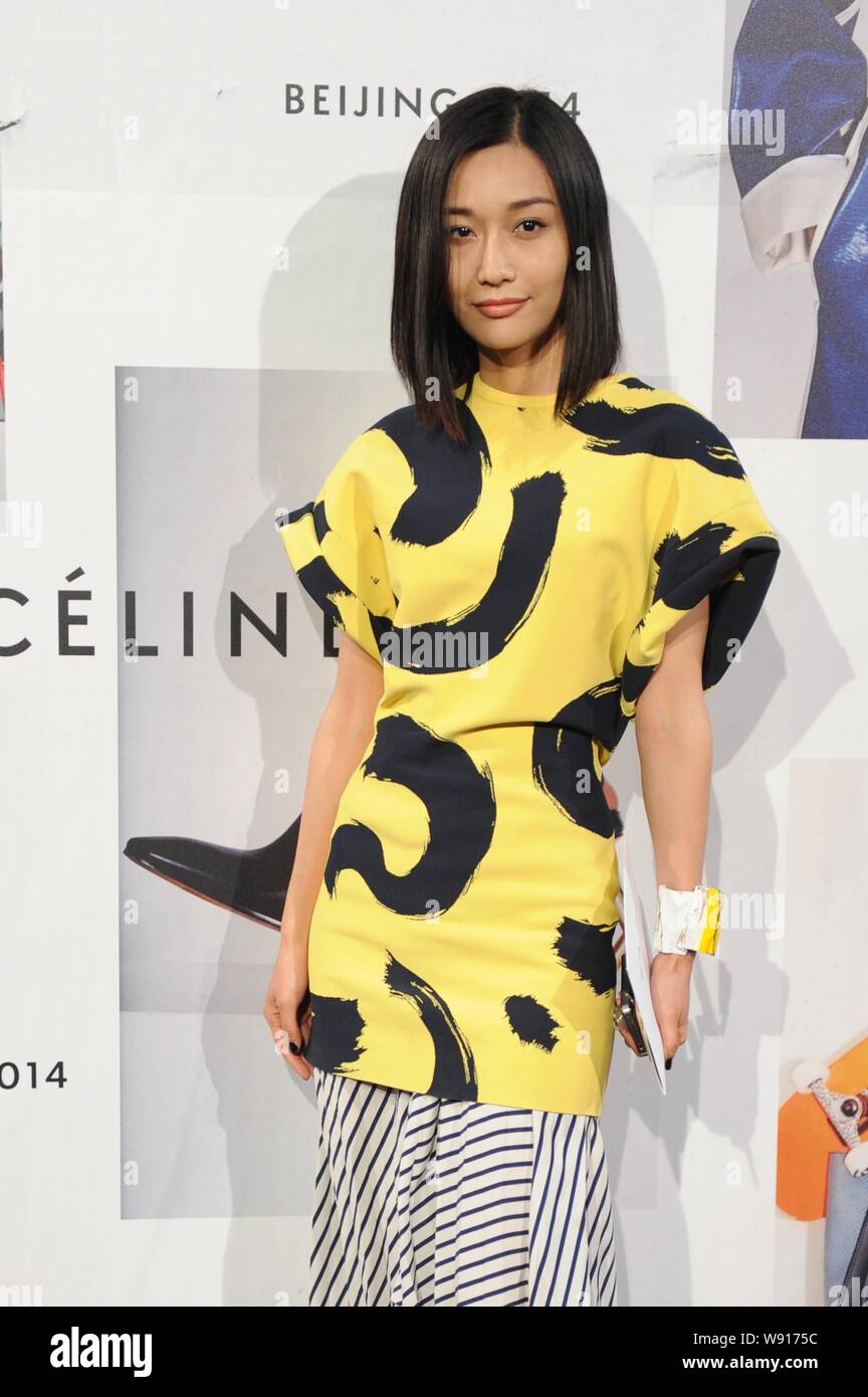 Chinese actress Tian Yuan poses as she arrives at the Celine 2014 Fall ...