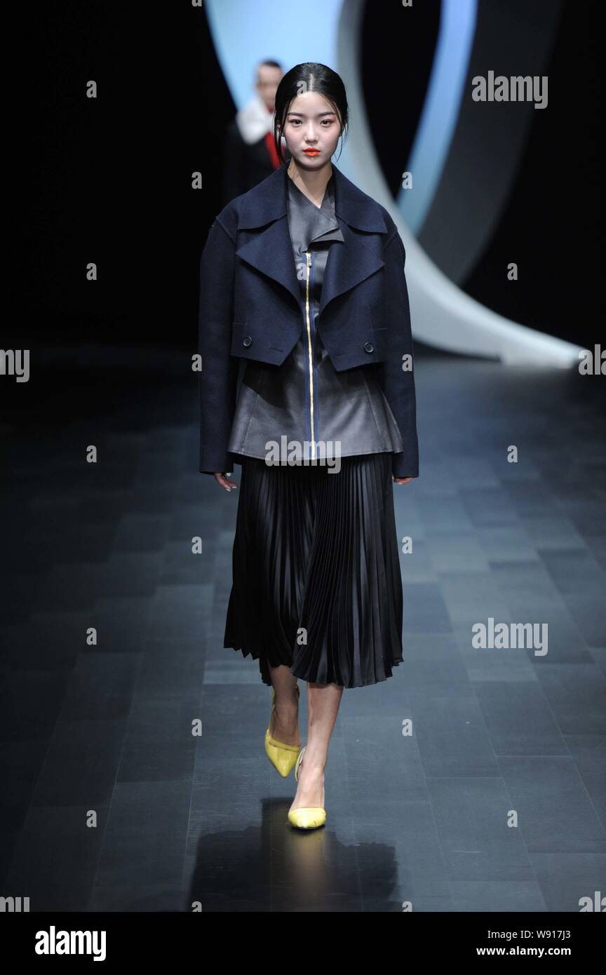 A model displays a new creation by Chinese fashion designer Wang Yutao at the Beauty Berry Wang ...