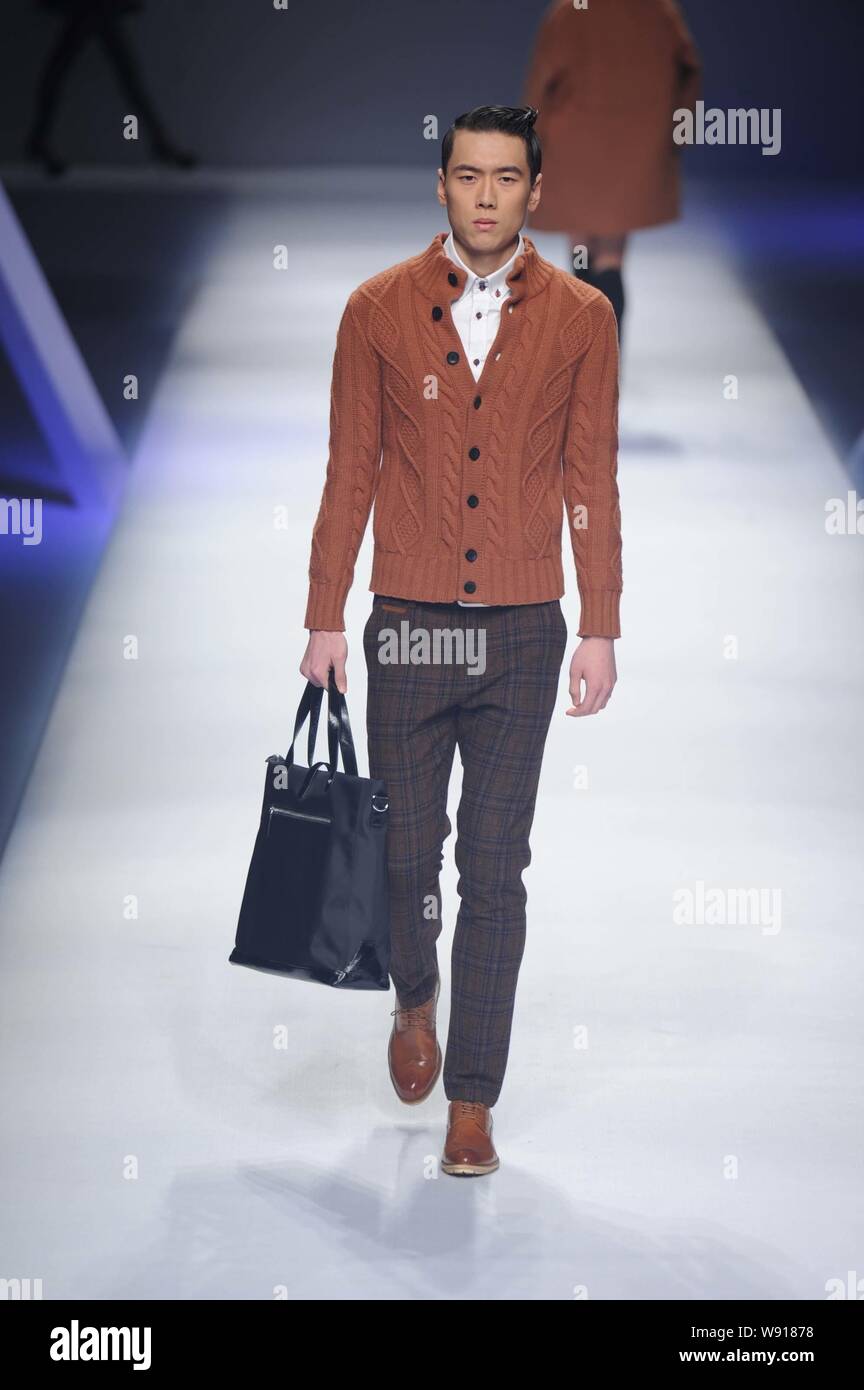 A model displays a new creation by Chinese fashion designer Yuan Bing ...