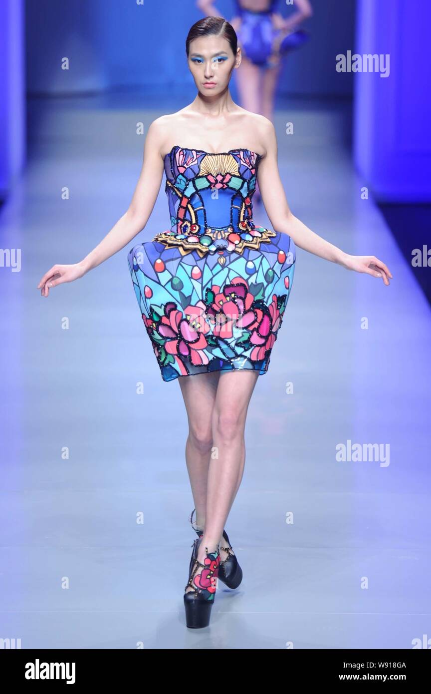 A model displays a new creation at the 22nd Hanbo Cup International ...