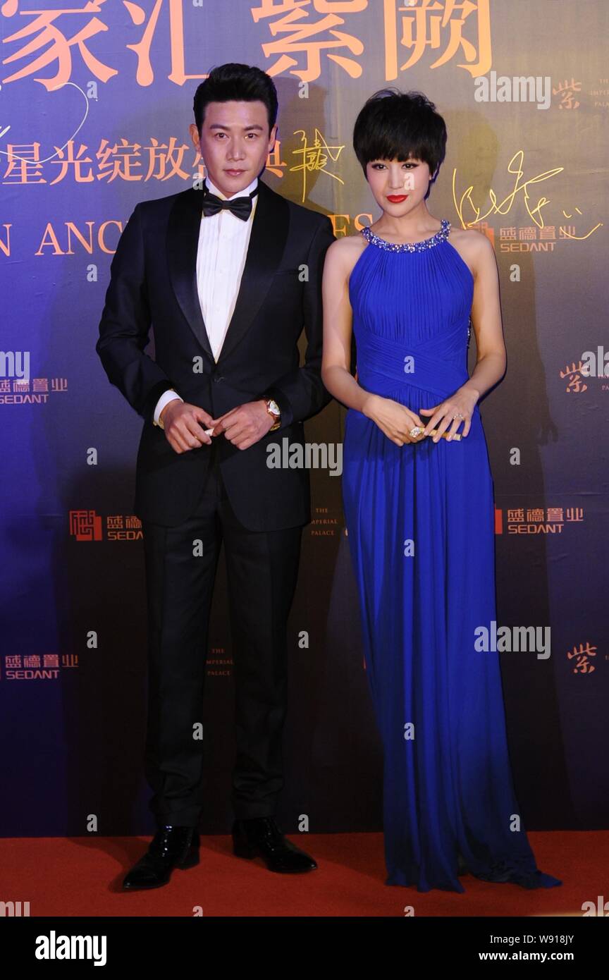 Chinese actor Lu Yi, left, and his actress wife Bao Lei pose on the red carpet for the Sedant ...