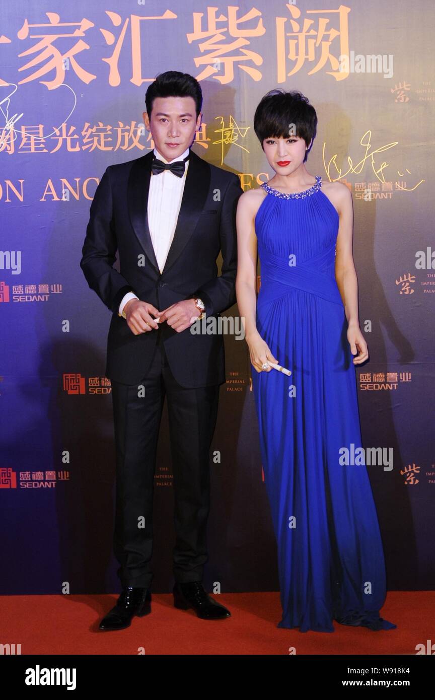 Chinese actor Lu Yi, left, and his actress wife Bao Lei pose on the red ...