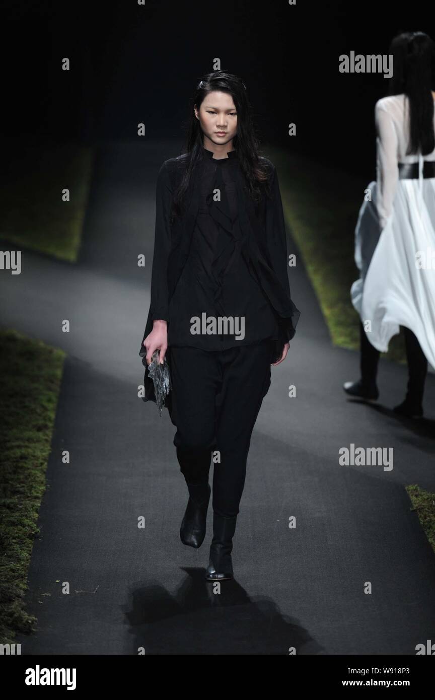 A model displays a new creation at the Ban Xiao Xue collection Fashion ...