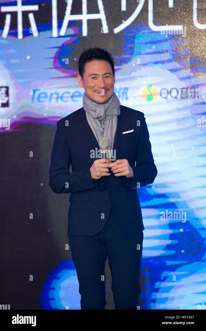 Hong Kong singer Jacky Cheung laughs during a press conference for his ...