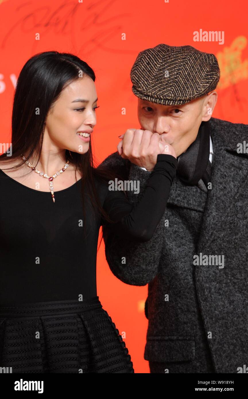 Chinese actor Ge You, right, kisses Taiwanese actress Shu Qi's hand on ...