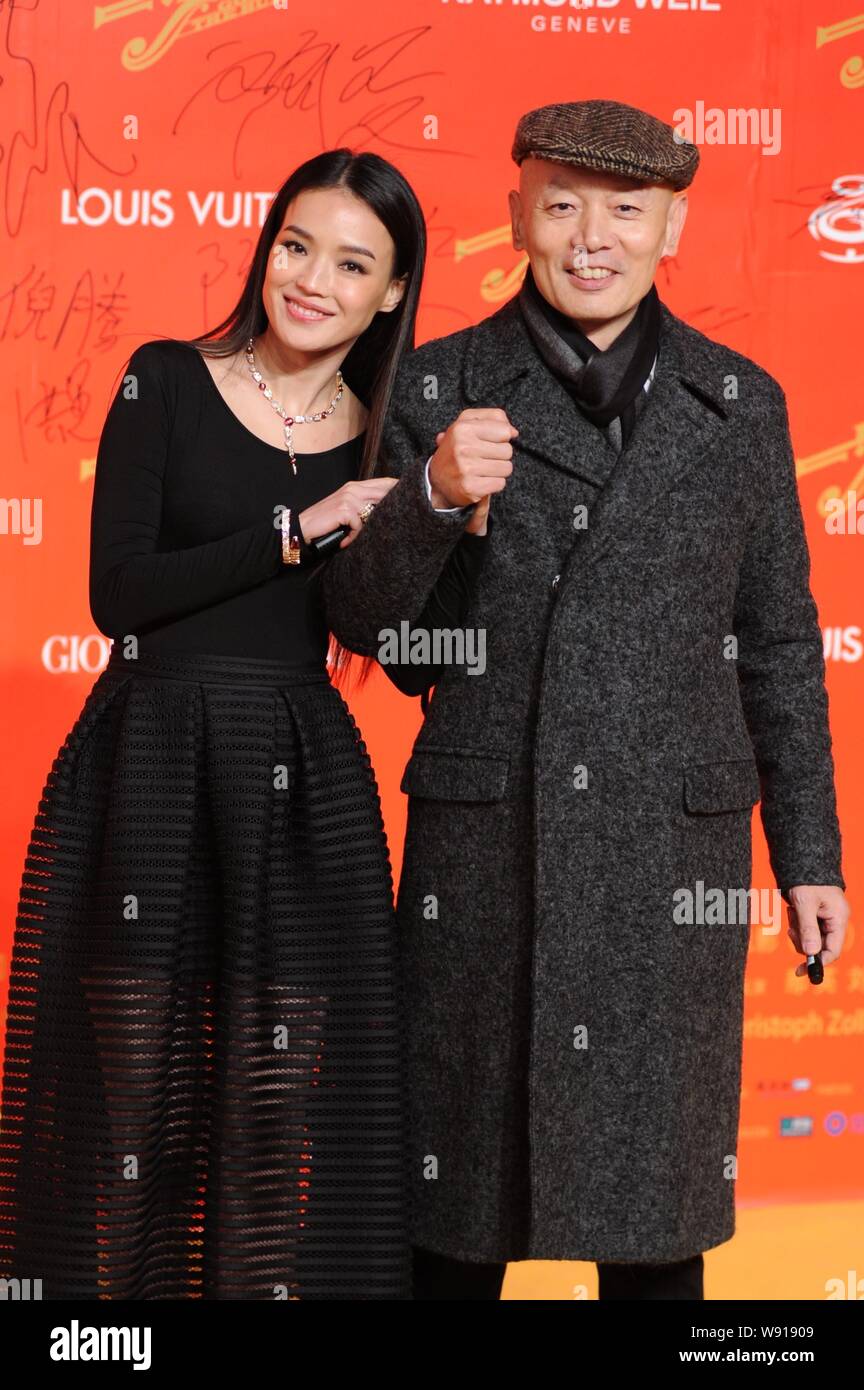 Taiwanese actress Shu Qi, left, holds hands with Chinese actor Ge You ...