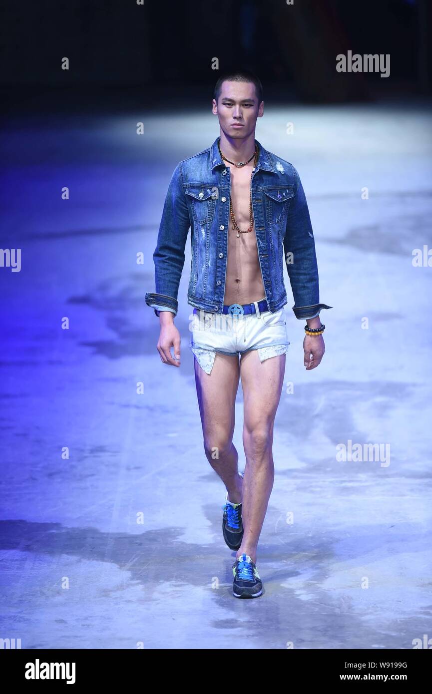 A model displays a new creation by designer Liu Yiqun at the Wolfzone ...