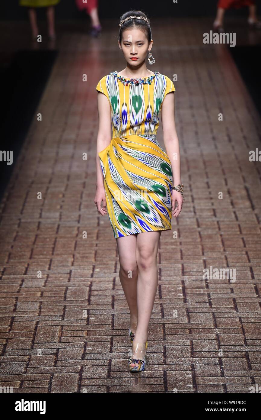 A model displays a new creation by designer Cheng Yingfen at the ...