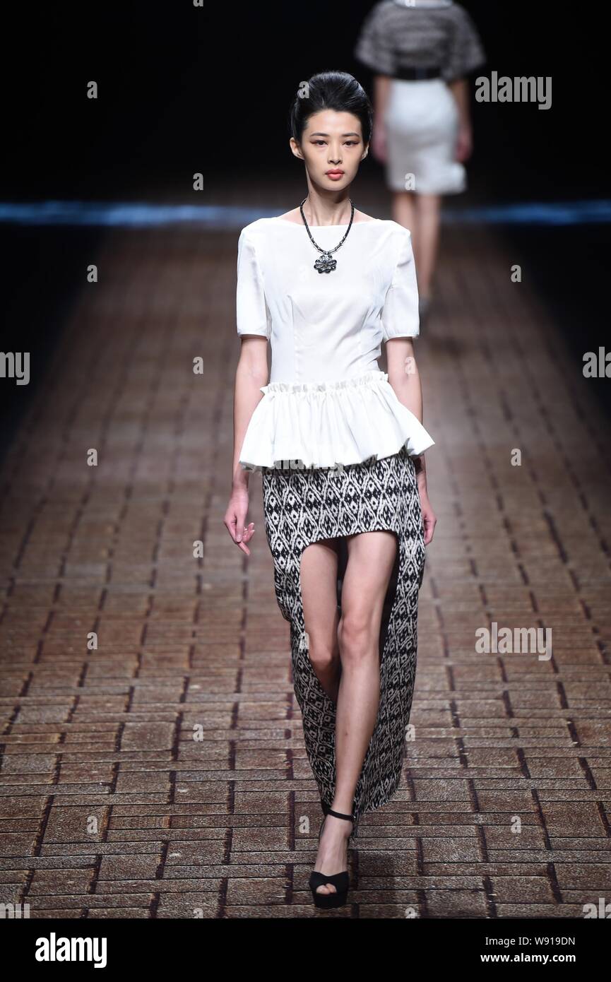A model displays a new creation by designer Cheng Yingfen at the ...