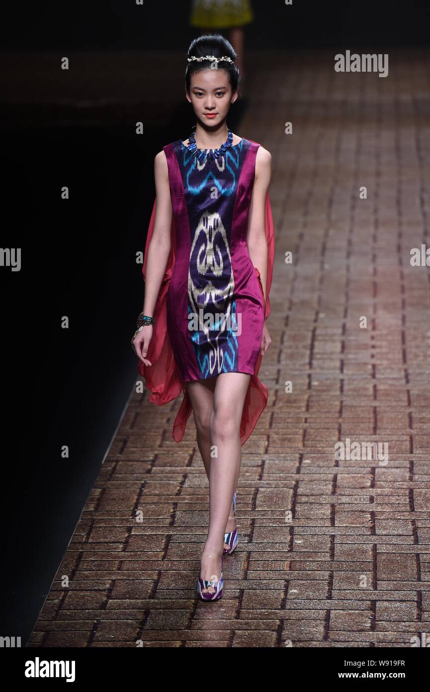 A model displays a new creation by designer Cheng Yingfen at the ...