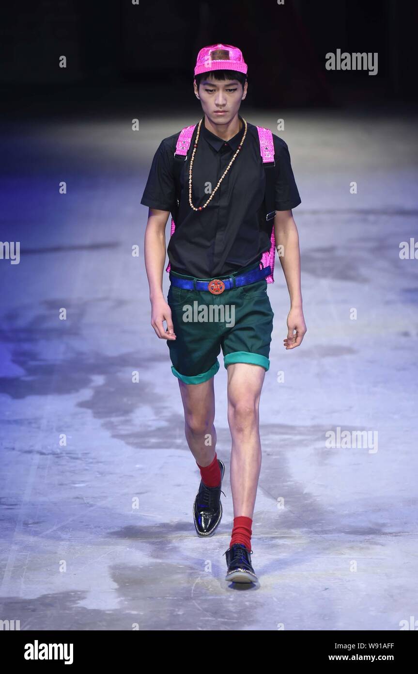 A model displays a new creation by designer Liu Yiqun at the Wolfzone ...