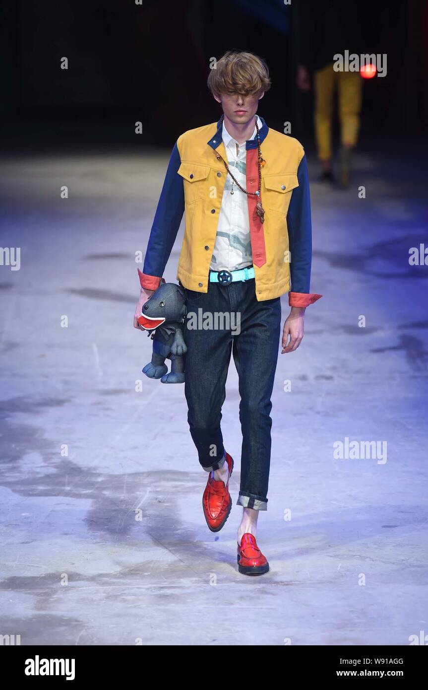 A model displays a new creation by designer Liu Yiqun at the Wolfzone ...