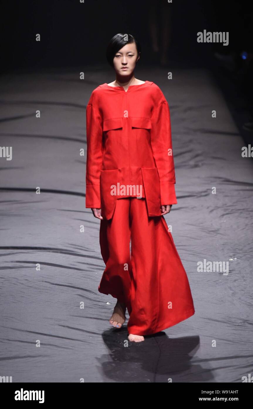 A model displays a new creation by designer Badwin Cheung at the Just ...