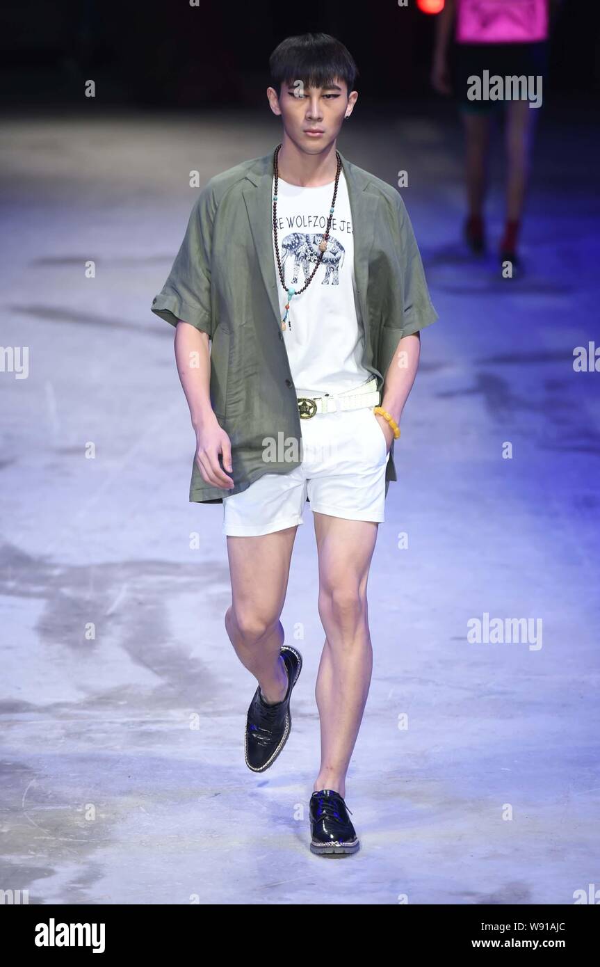 A model displays a new creation by designer Liu Yiqun at the Wolfzone ...