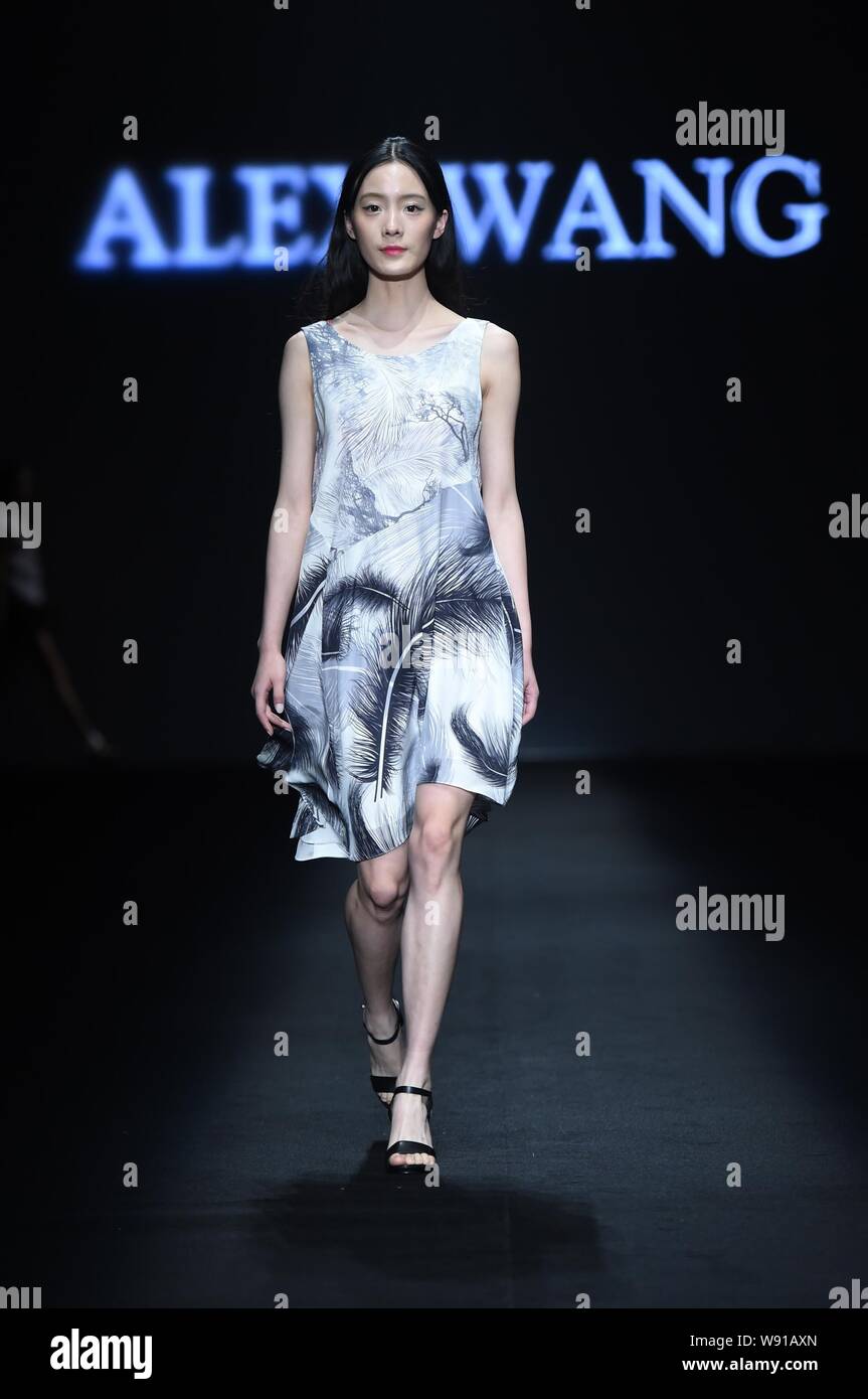 A model displays a new creation by designer Wang Peiyi at the Alex Wang-Wang Peiyi fashion show ...