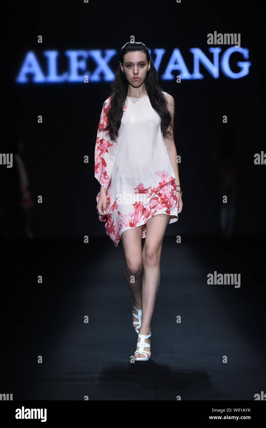 A model displays a new creation by designer Wang Peiyi at the Alex Wang-Wang Peiyi fashion show ...