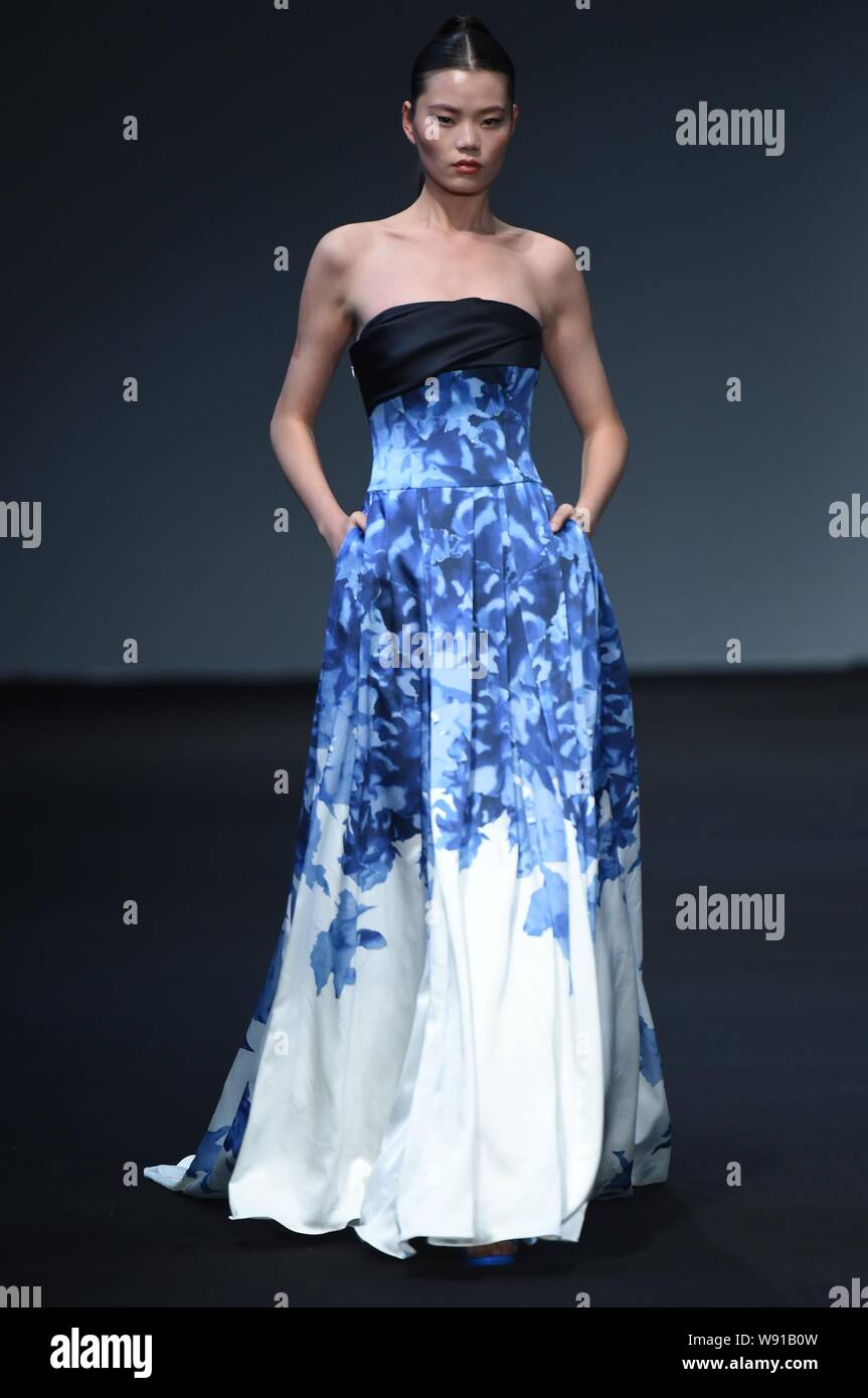 A model displays a new creation by designer Wang Peiyi at the Alex Wang-Wang Peiyi fashion show ...