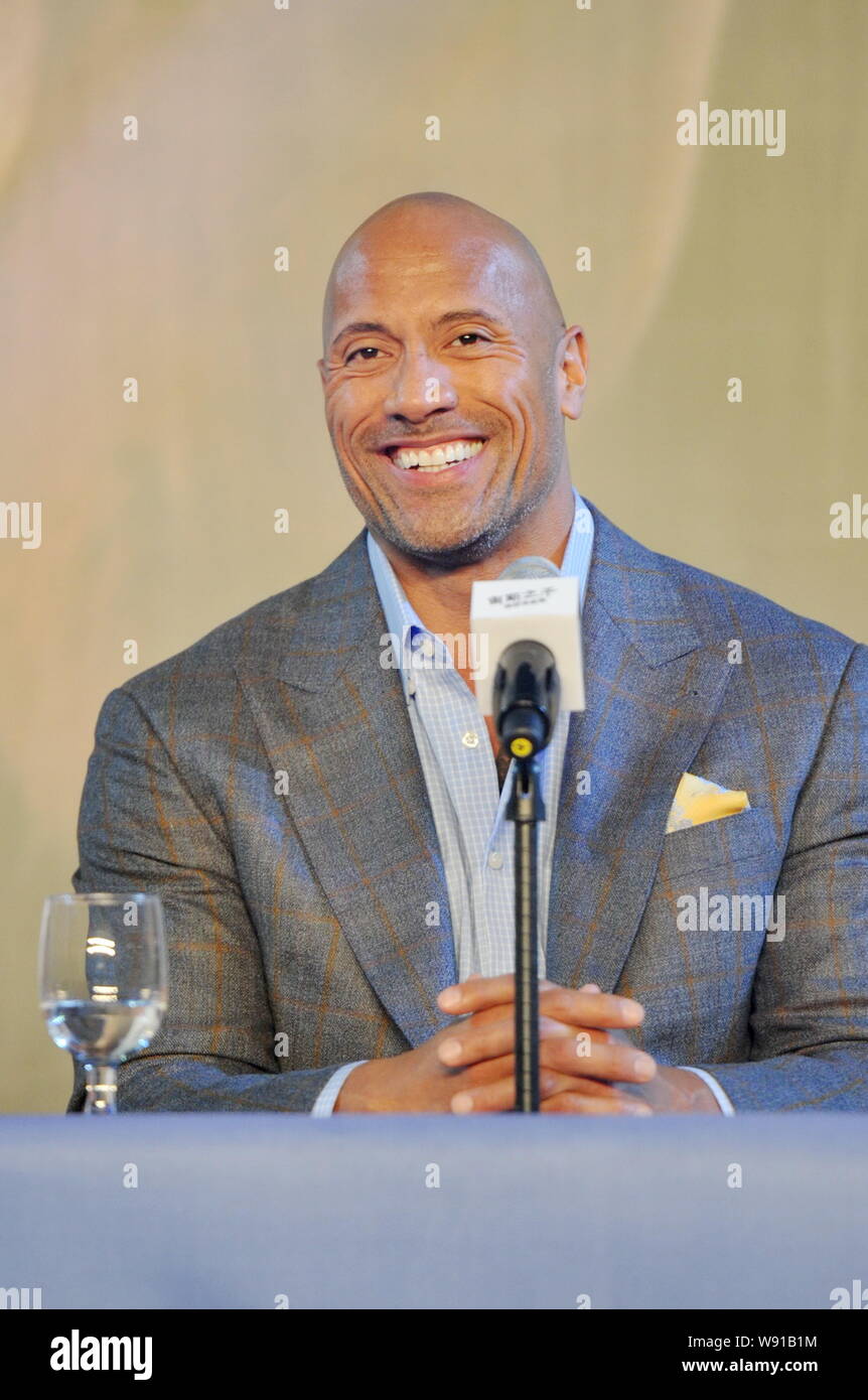 American actor Dwayne Johnson smiles during a press conference for his ...