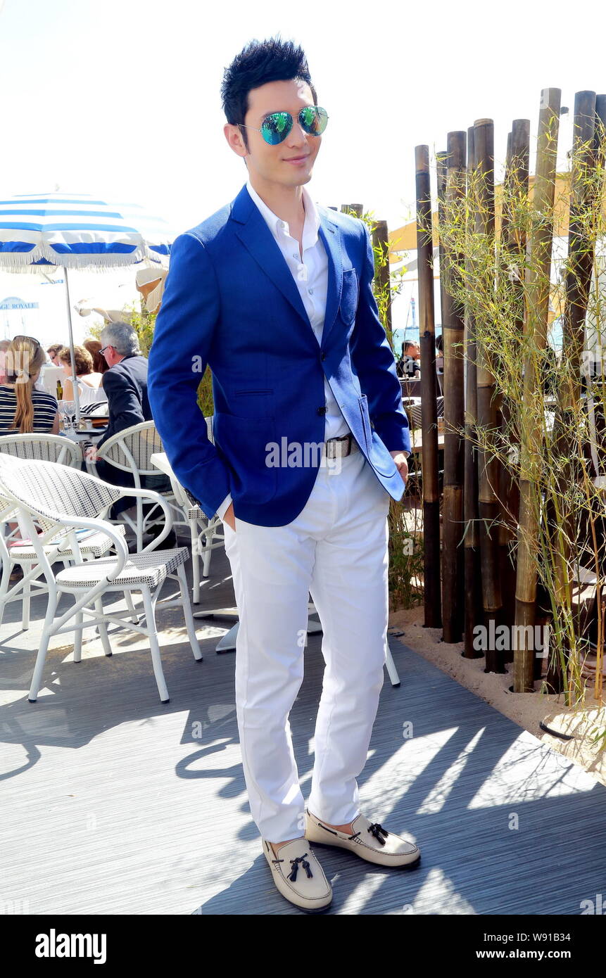 Chinese actor Huang Xiaoming poses at a photocall for his movie, The ...