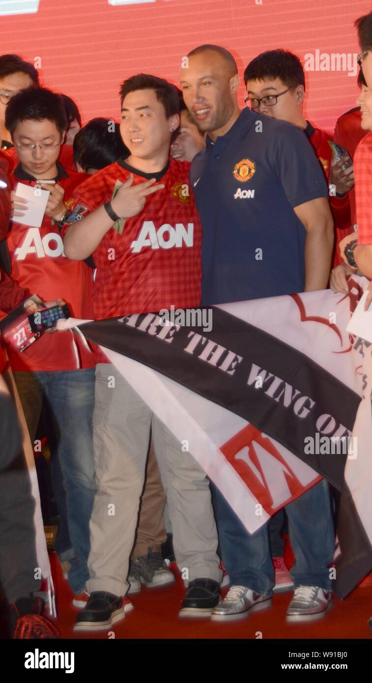 French football player Mikael Silvestre, front right, poses for photos ...