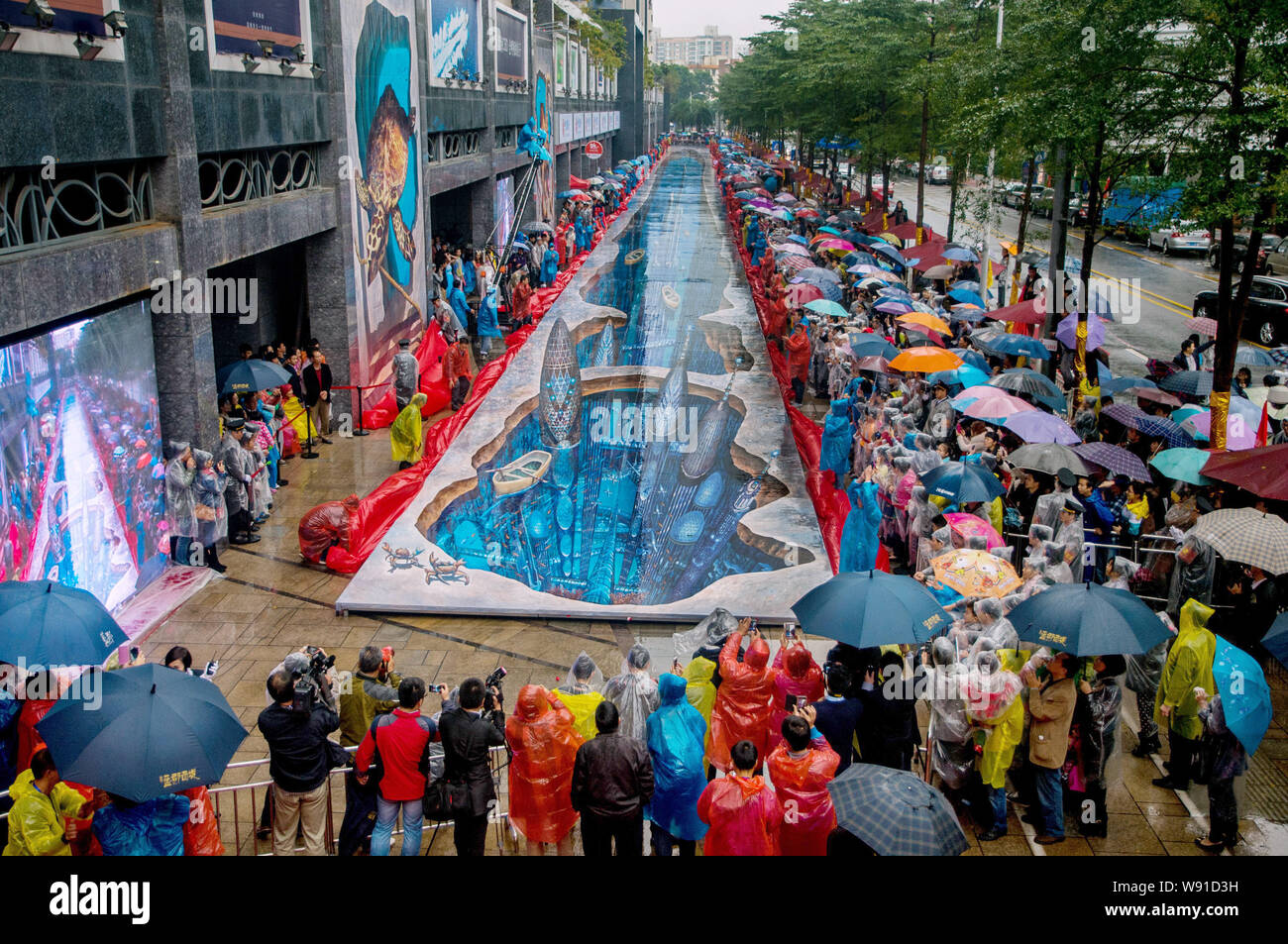 Visitors look at the 200-meter long, 6.1-meter wide 3D painting created ...