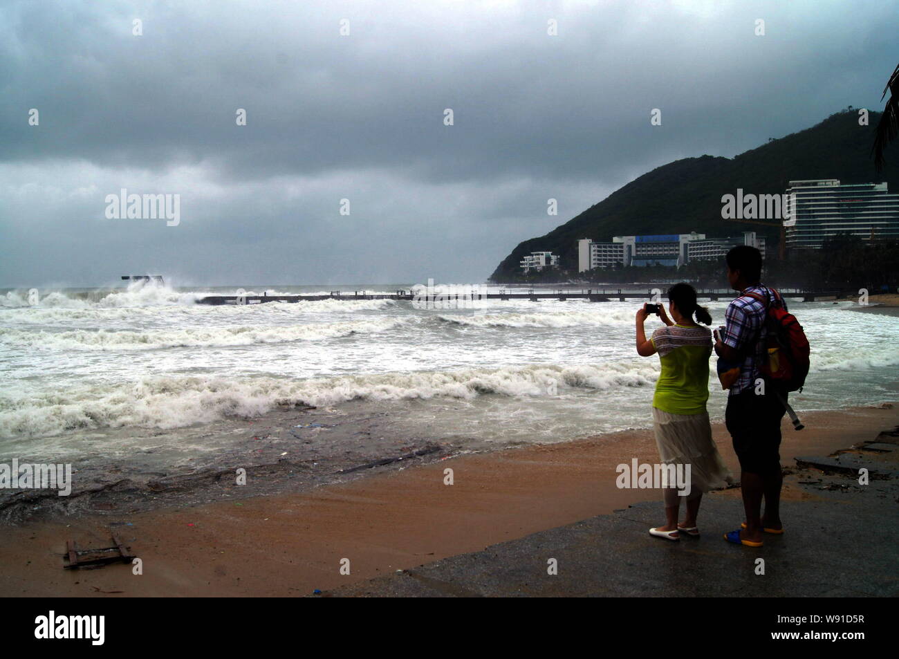 Local Chinese residents look at huge waves caused by approaching ...
