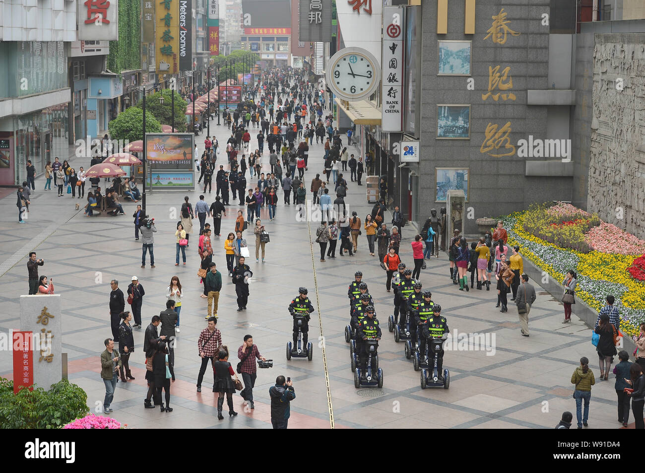 Chinese police officers ride Segway-like two-wheeled electric vehicles ...