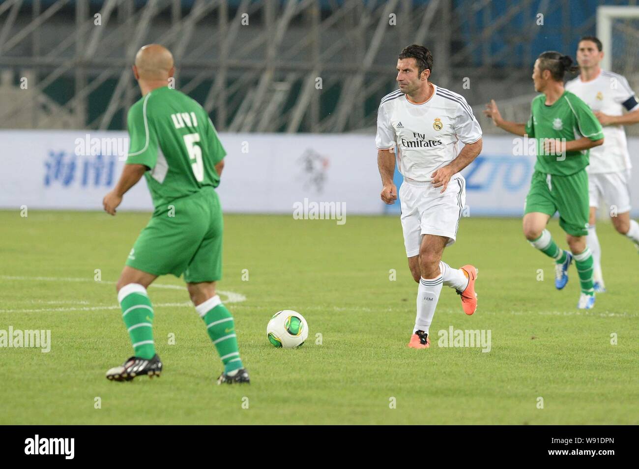 Portuguese football star Luis Figo of Real Madrid Leyendas, second left ...
