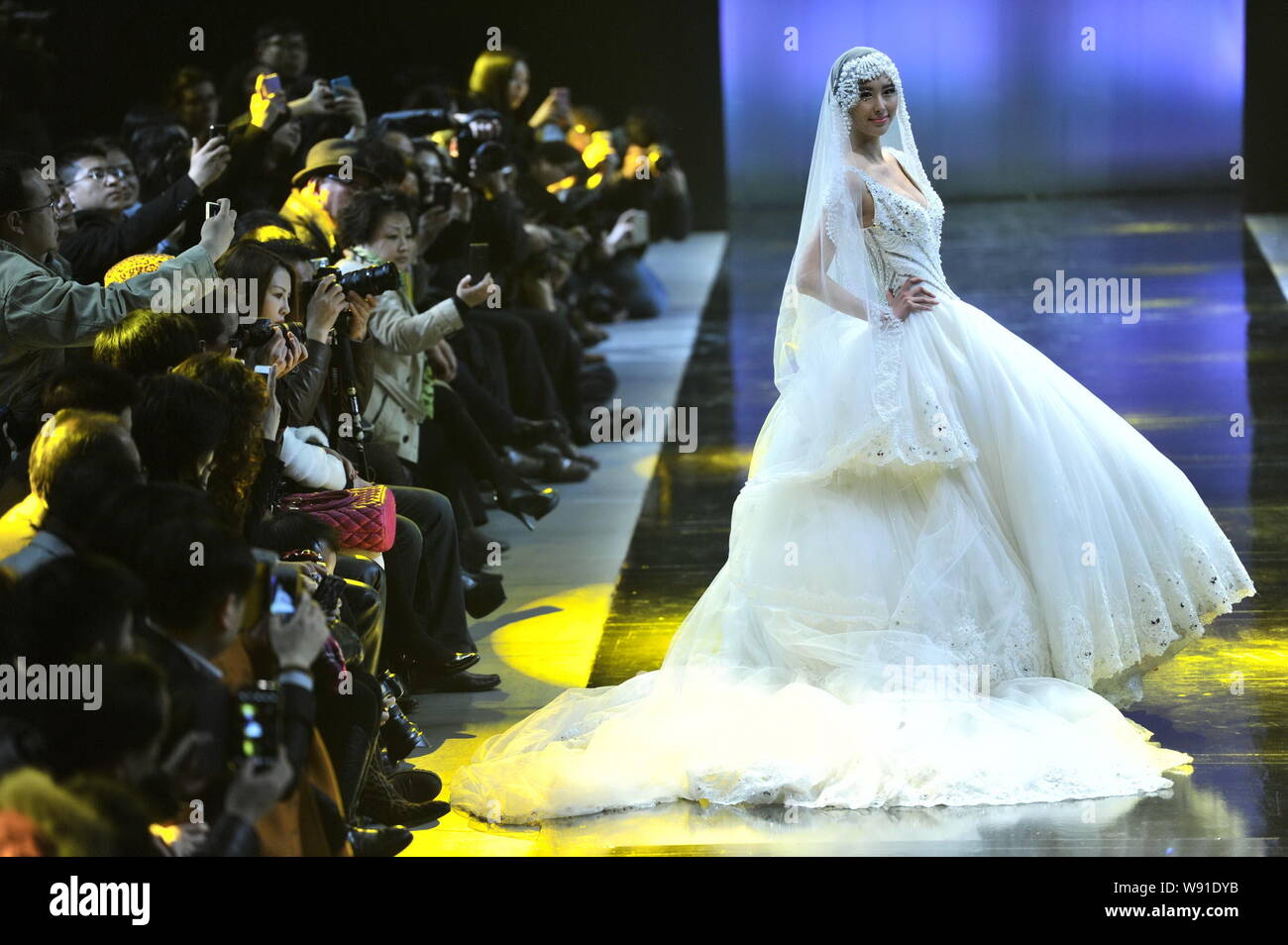 Chinese model Zhai Ling displays a new creation by Chinese fashion ...