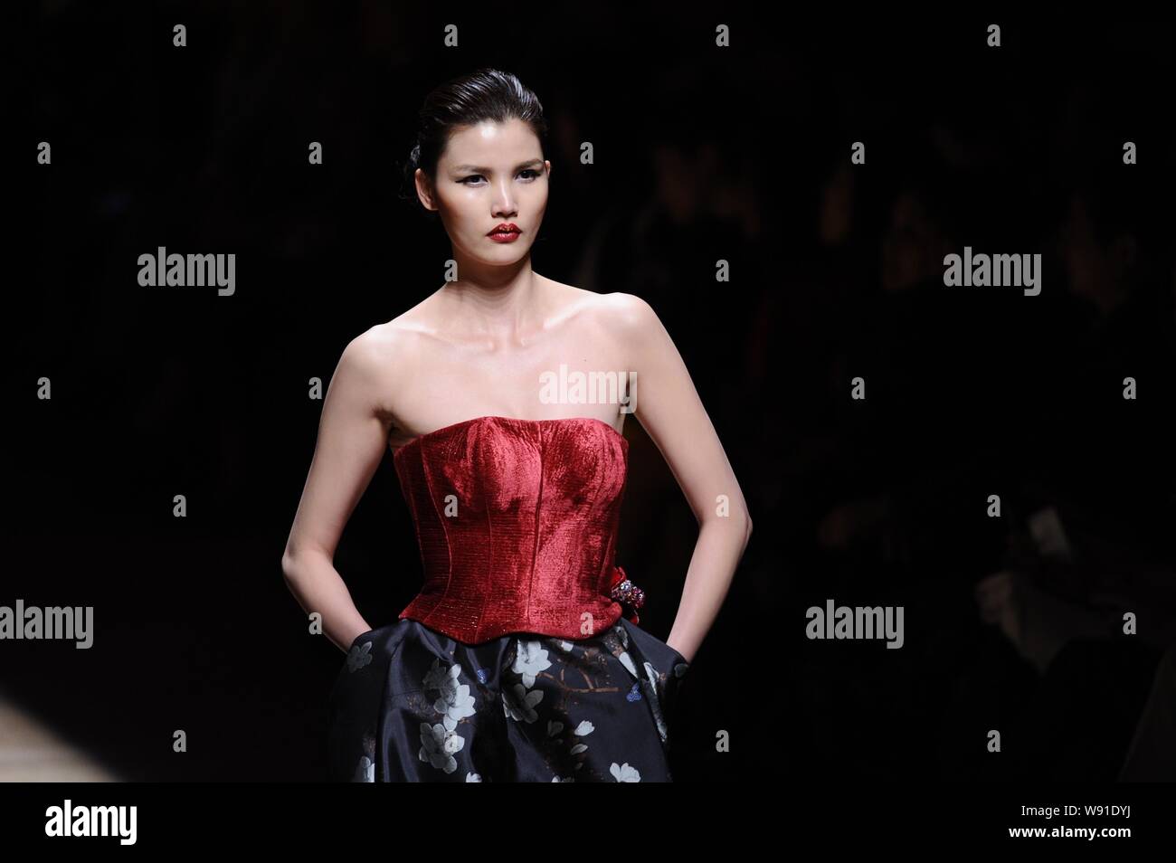 Chinese model Mo Wandan displays a new creation by Chinese fashion ...