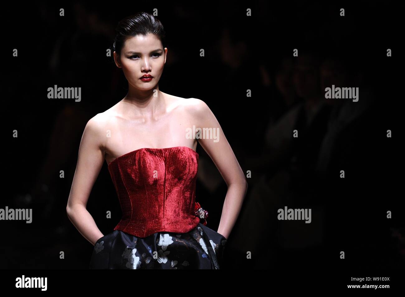 Chinese model Mo Wandan displays a new creation by Chinese fashion ...
