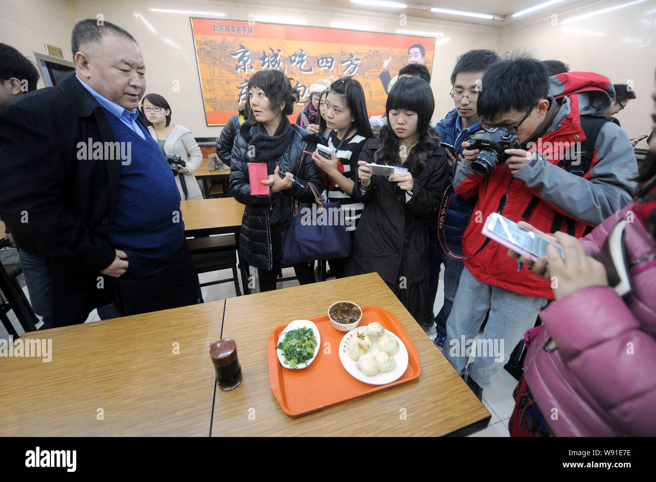 Visitors take photos of the same set of meals ordered by Chinese ...