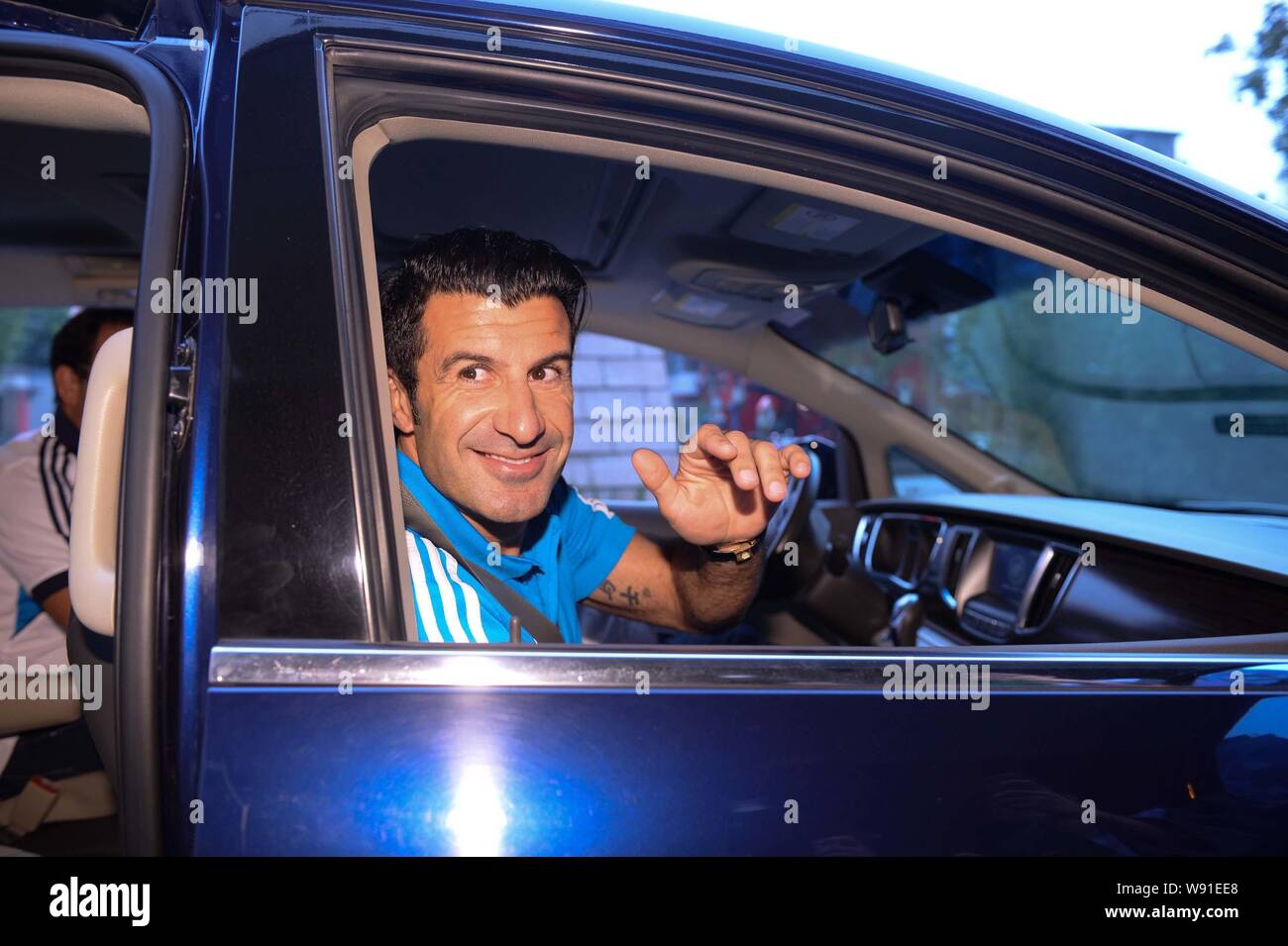Portuguese football star Luis Figo of Real Madrid Leyendas smiles as he ...
