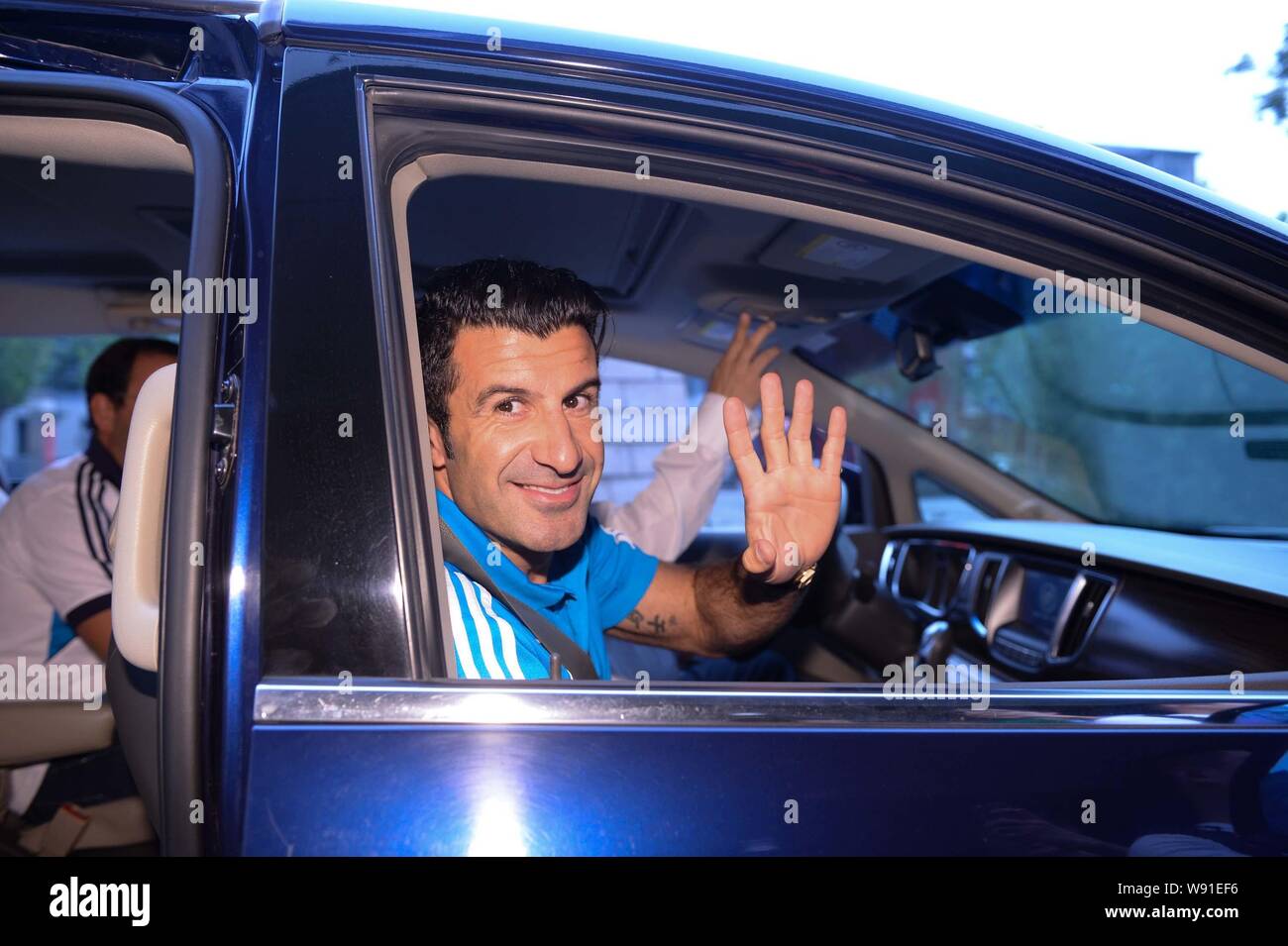 Portuguese football star Luis Figo of Real Madrid Leyendas waves as he ...