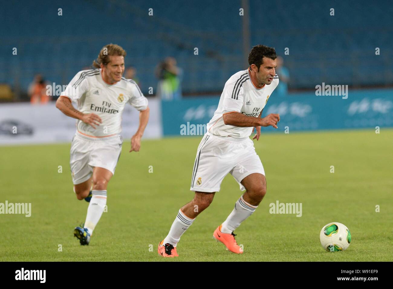 Portuguese football star Luis Figo of Real Madrid Leyendas, right ...