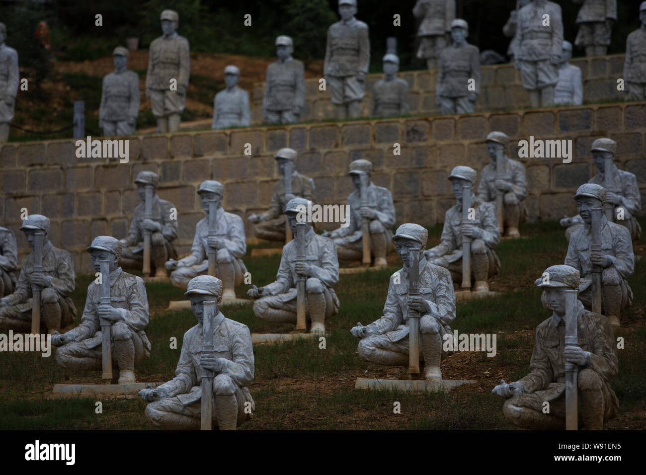 Sculptures of soldiers from the China Expeditionary Force are displayed ...
