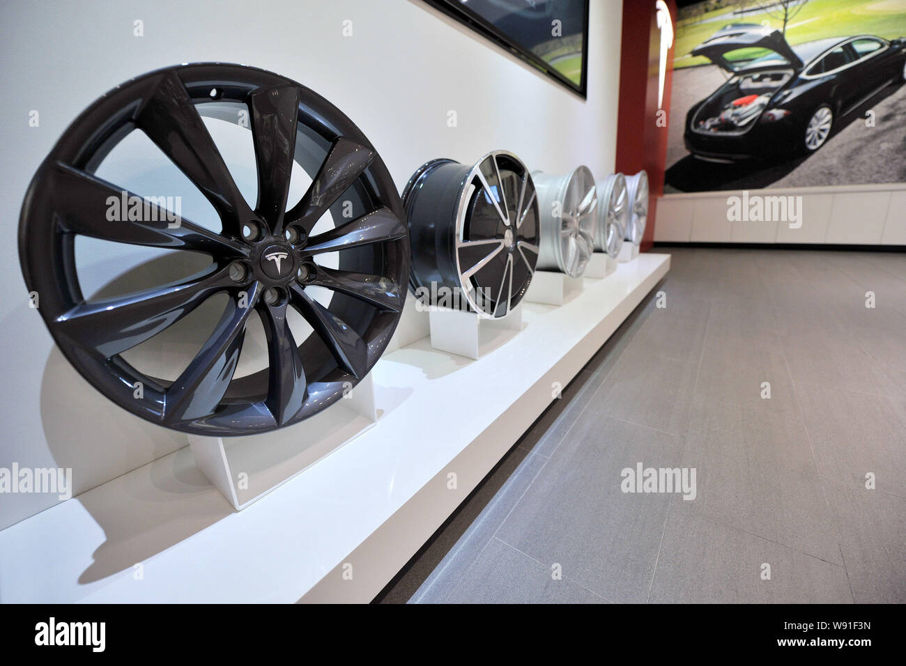 Optional rims for the Model S electric car are displayed at the Tesla ...