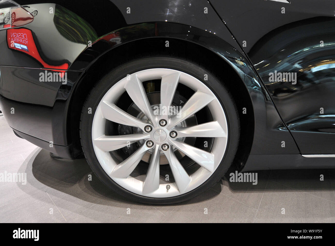 A black Model S electric car is displayed at the Tesla store in Beijing ...