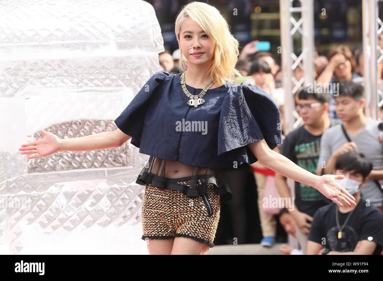 Taiwanese singer Jolin Tsai poses during a signing event for her ...