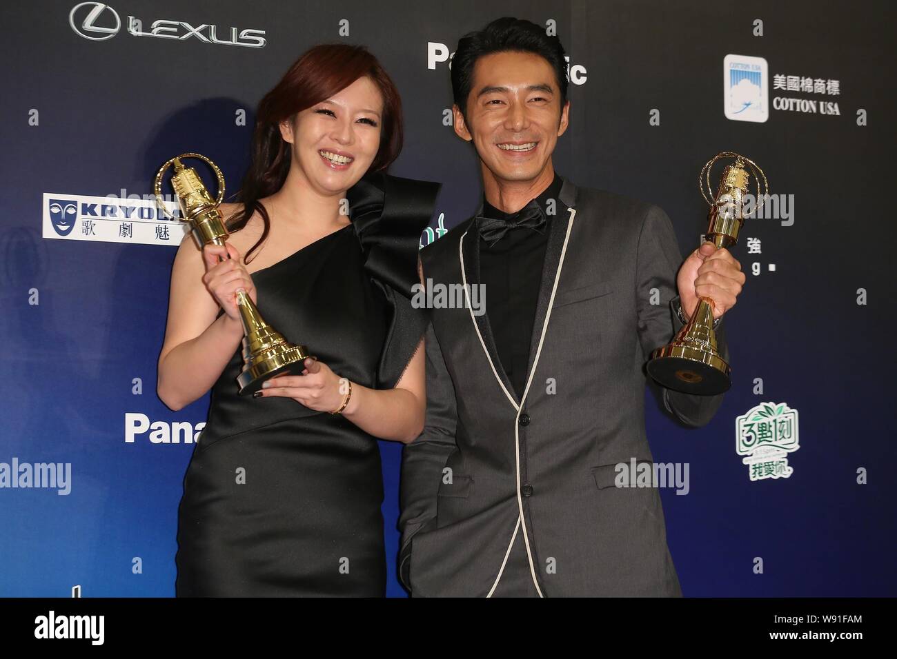 Taiwanese actress Esther Liu, left, and actor Lee Lee-zen? hold up ...