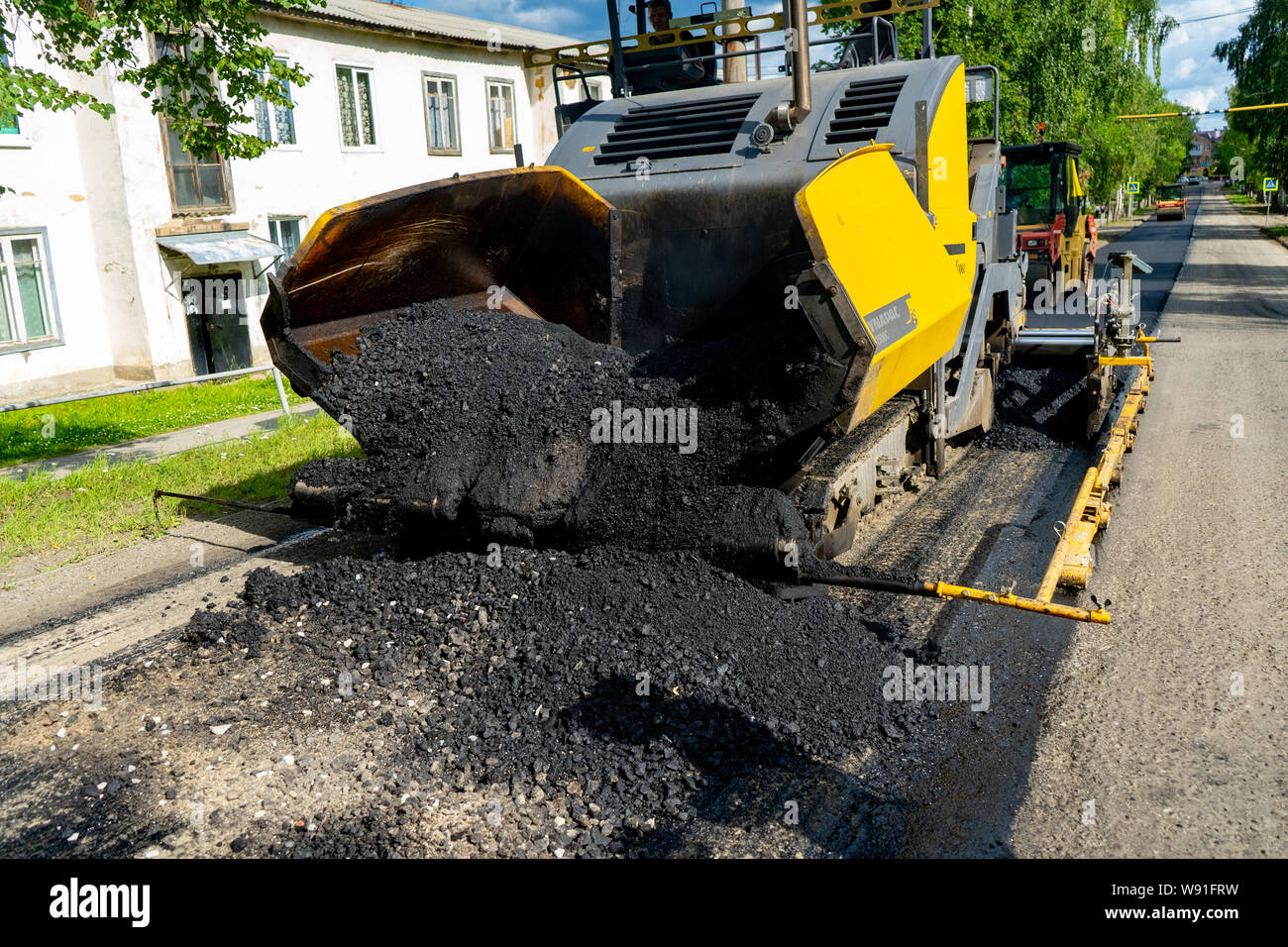 Chelyabinsk Region, Russia - August 2019. Loading hot asphalt. Road ...
