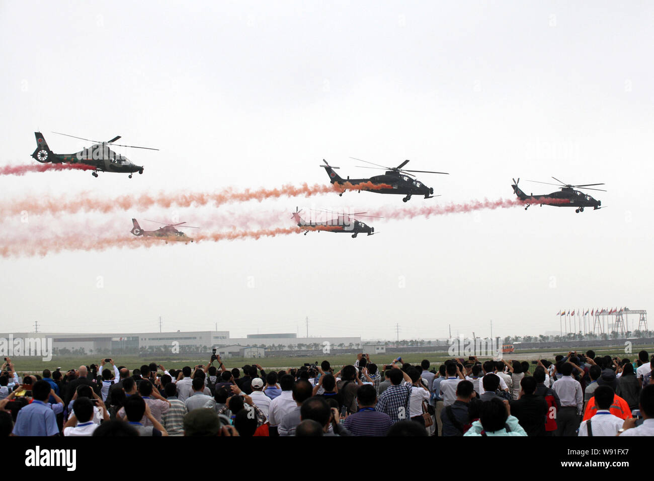 Chinese WZ-10 attack helicopters, righ, and WZ-9 military helicopters ...